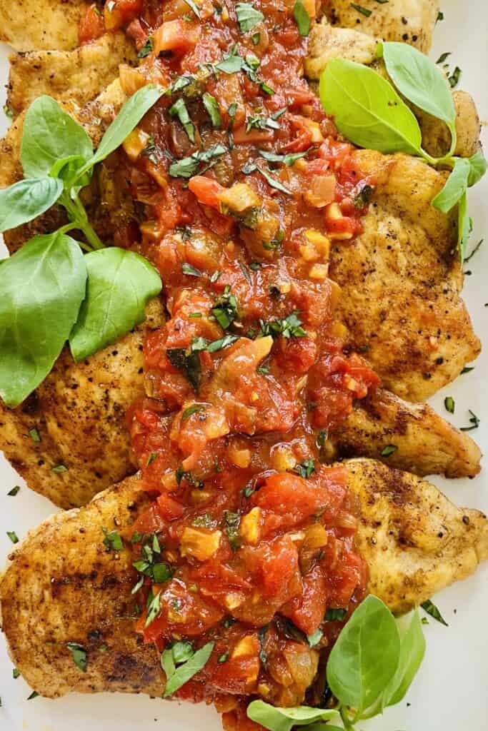 Butter Sauteed Chicken Breast with Fresh Tomato, Wine and Basil Sauce