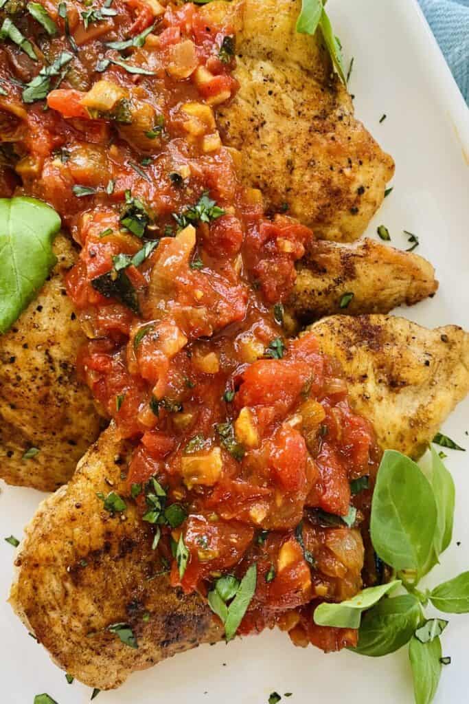 Butter Sauteed Chicken Breast with Fresh Tomato, Wine and Basil Sauce